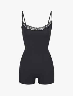 SKIMS - Fits Everybody lace-trimmed stretch-woven jumpsuit | Selfridges.com