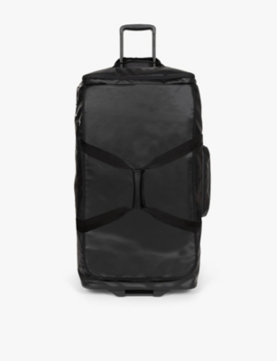 EASTPAK - Tarp Duffl'r Wheel shell suitcase | Selfridges.com